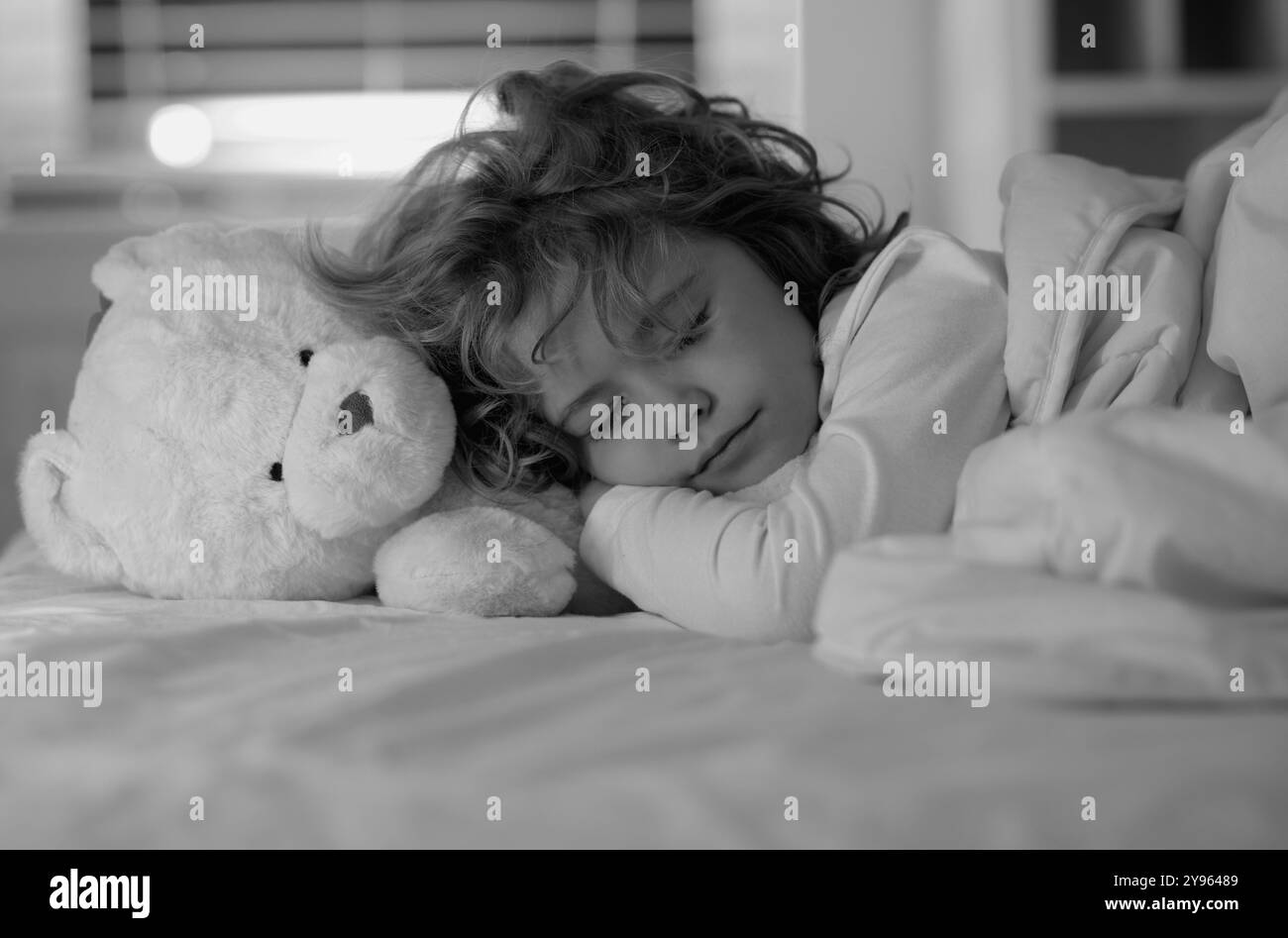 Calm kids sleep. Child boy sleep with a toy teddy bear, napping. Kid ...