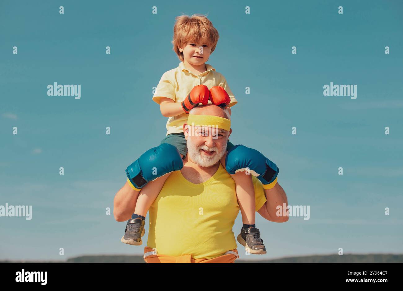 Grandfather and child fighting poses. Grandpa and little child boy in ...