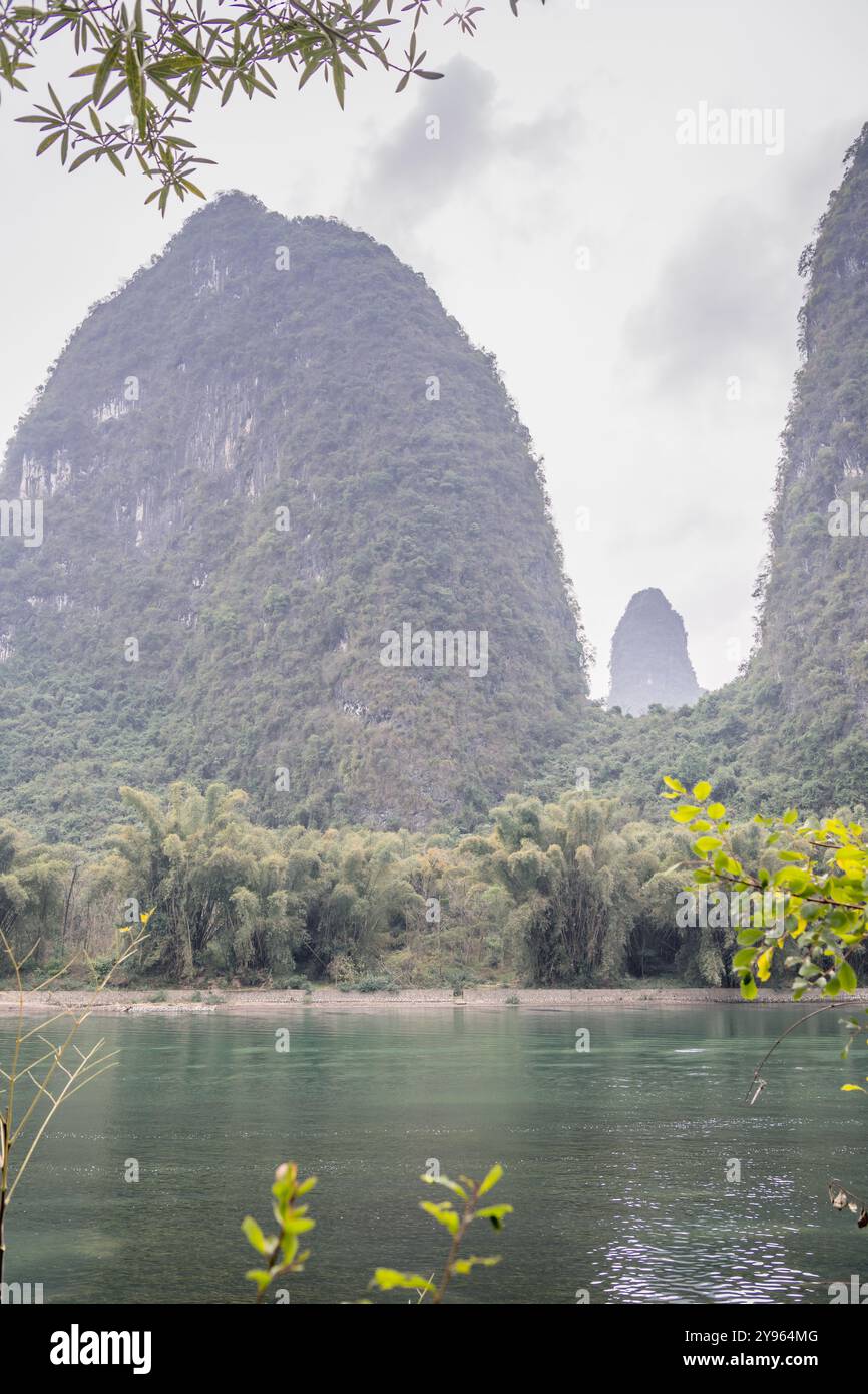 The shores of the Li river in Xing Ping, Guilin, China. Cloudy sky with ...