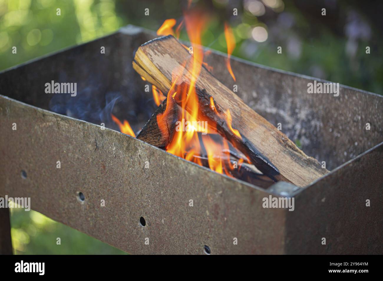 Open Air Rustic Metal Barbecue Grill with Firewood. Fire flame for BBQ ...