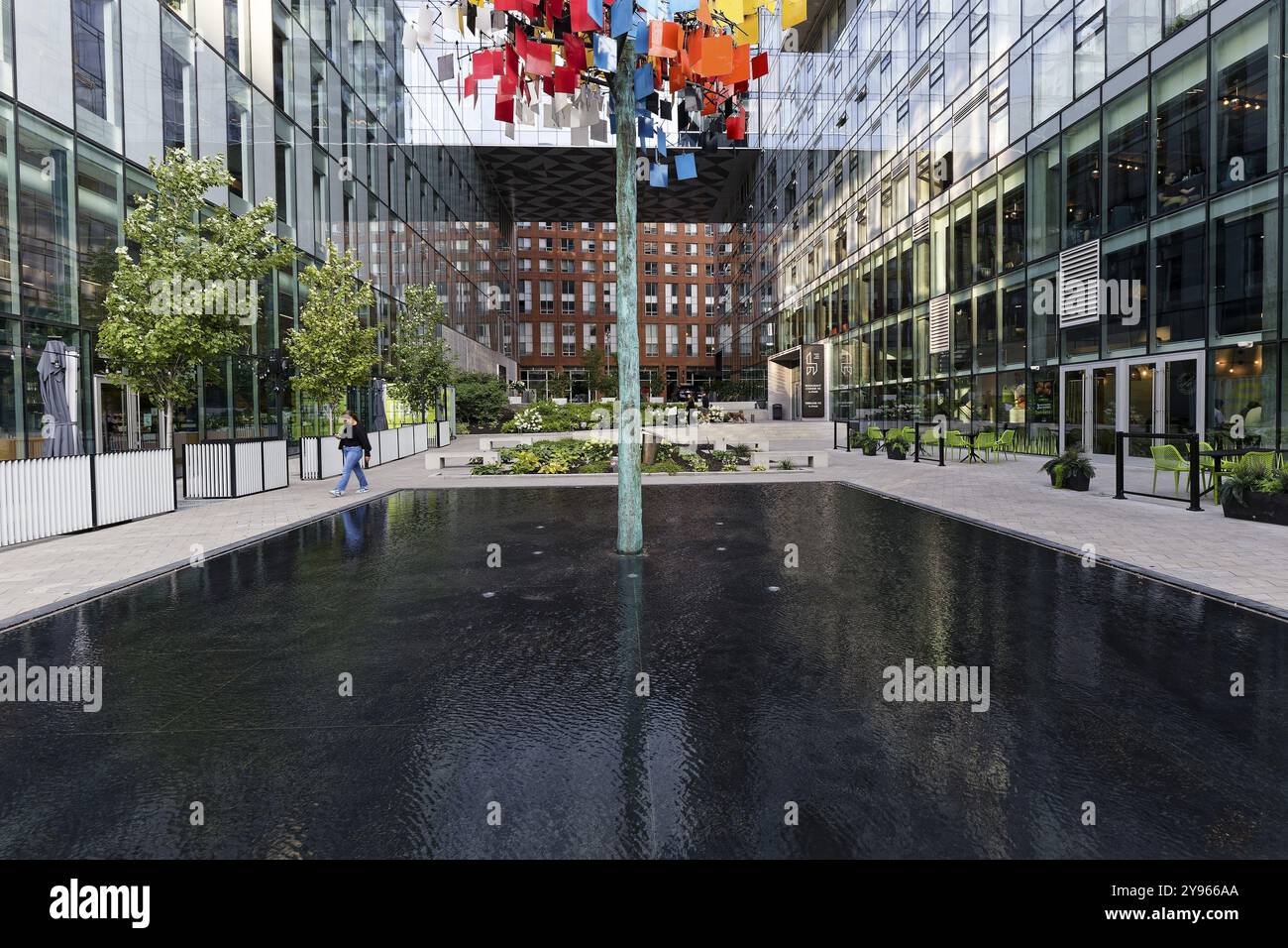 Water pool between modern buildings, Montreal, Province of Quebec ...