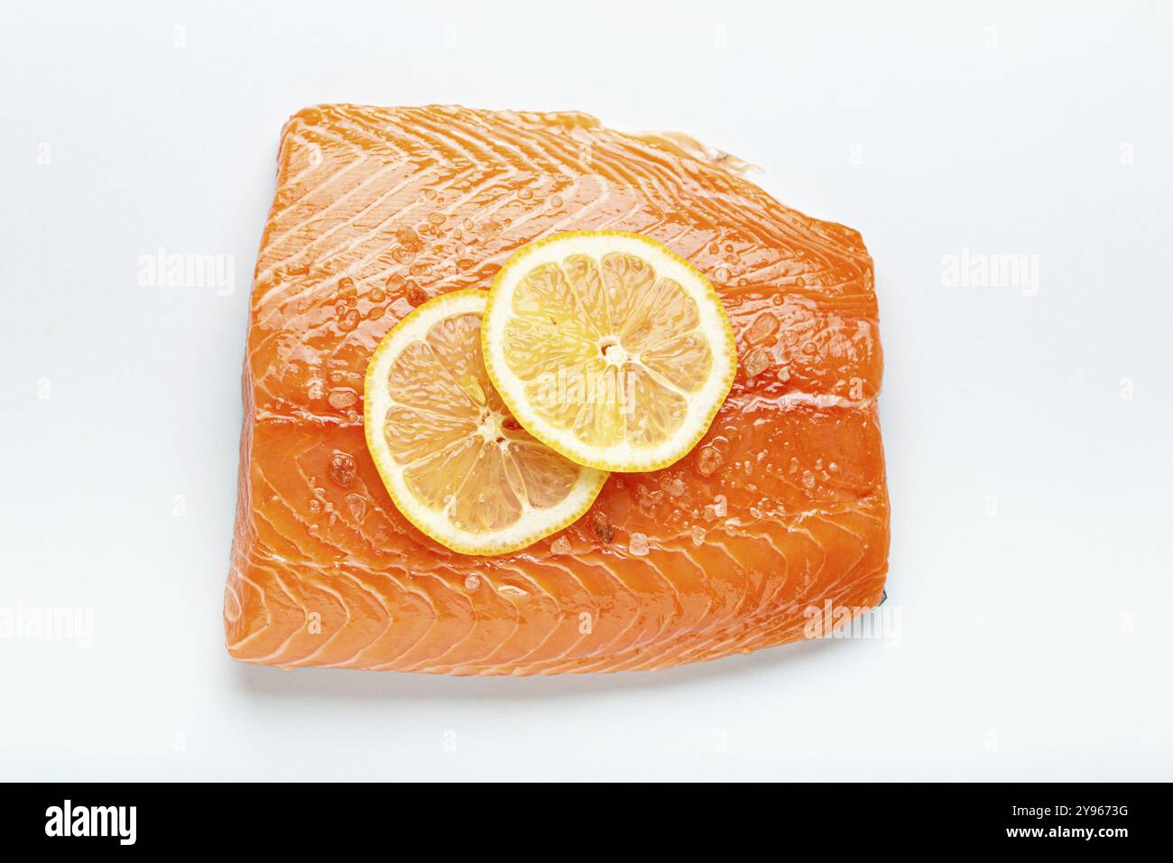 Fresh raw salmon marbled fillet isolated on white background with lemon ...