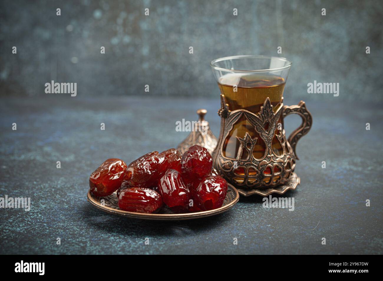 Breaking fasting with dried dates during Ramadan Kareem, Iftar meal ...