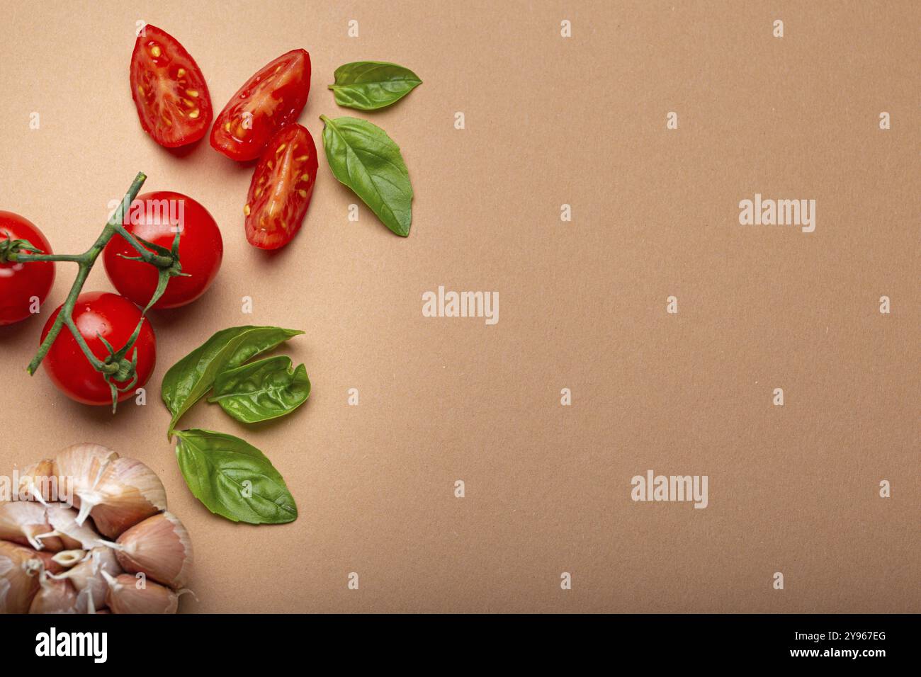 Food cooking border with cherry tomatoes, fresh green basil and garlic ...