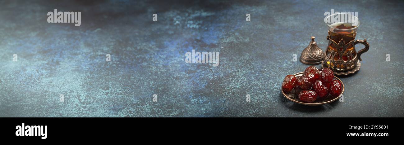 Breaking fasting with dried dates during Ramadan Kareem, Iftar meal ...