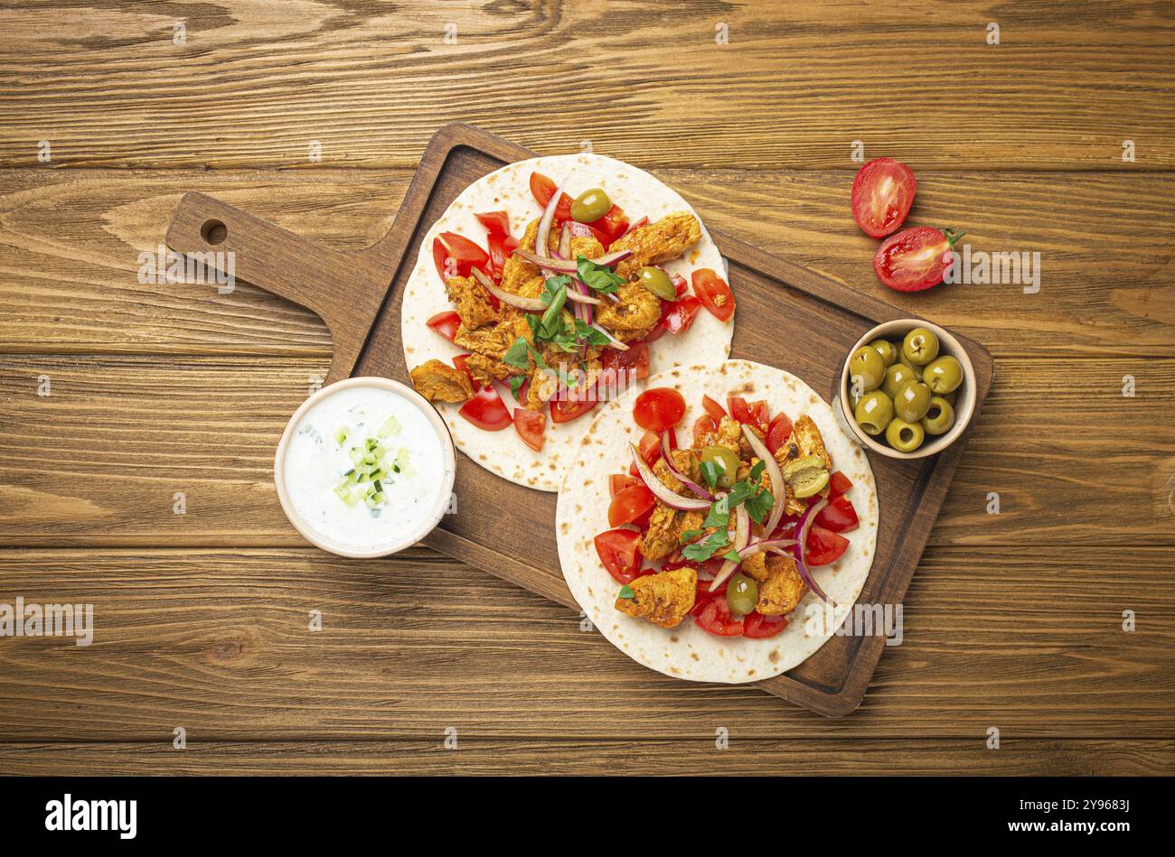 Cooking Traditional Greek Dish Gyros: Pita bread with vegetables, meat ...