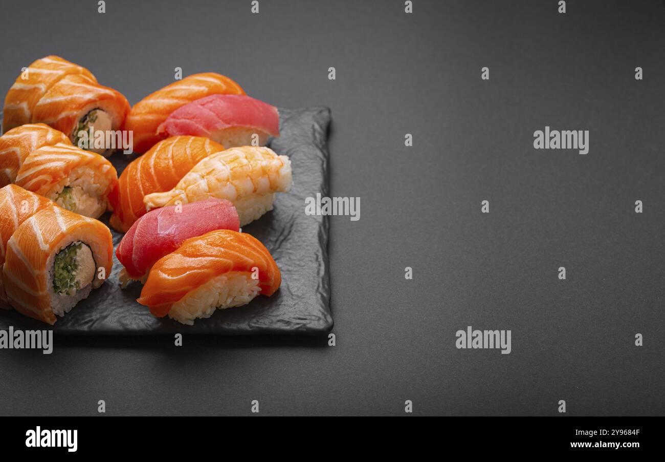 Set of traditional Japanese sushi and rolls angle view with soy sauce ...