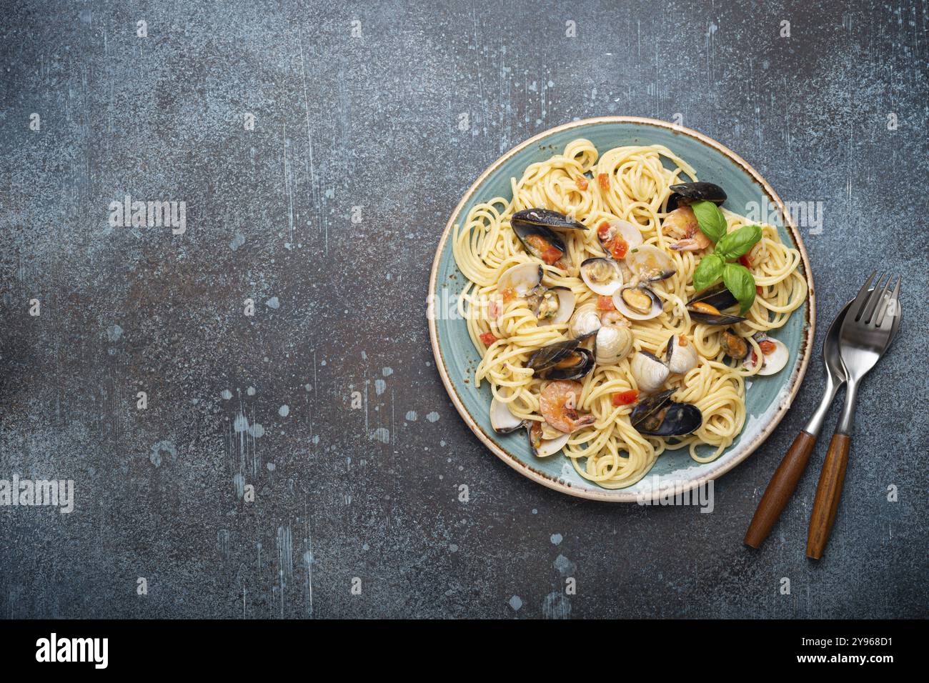 Italian seafood pasta spaghetti with mussels, shrimps, clams in tomato ...