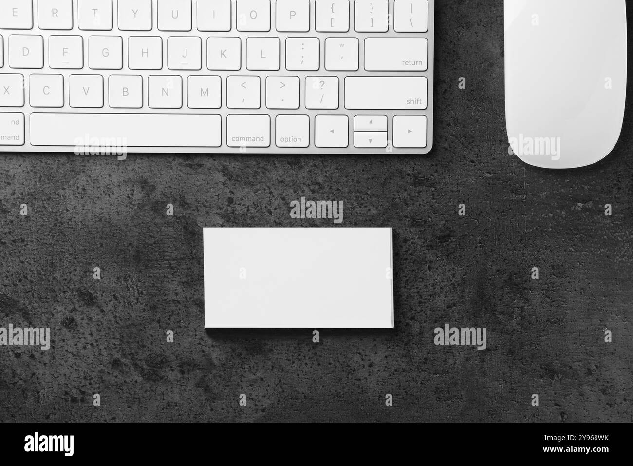 Blank business cards, computer mouse and keyboard on grey textured ...