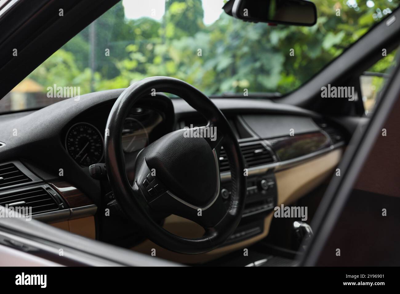 Steering wheel in modern car, view from outside Stock Photo - Alamy