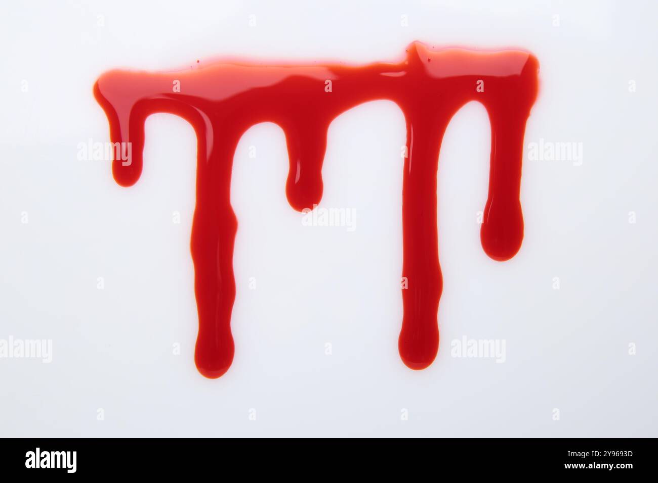 Leaking red blood stain on white background Stock Photo - Alamy