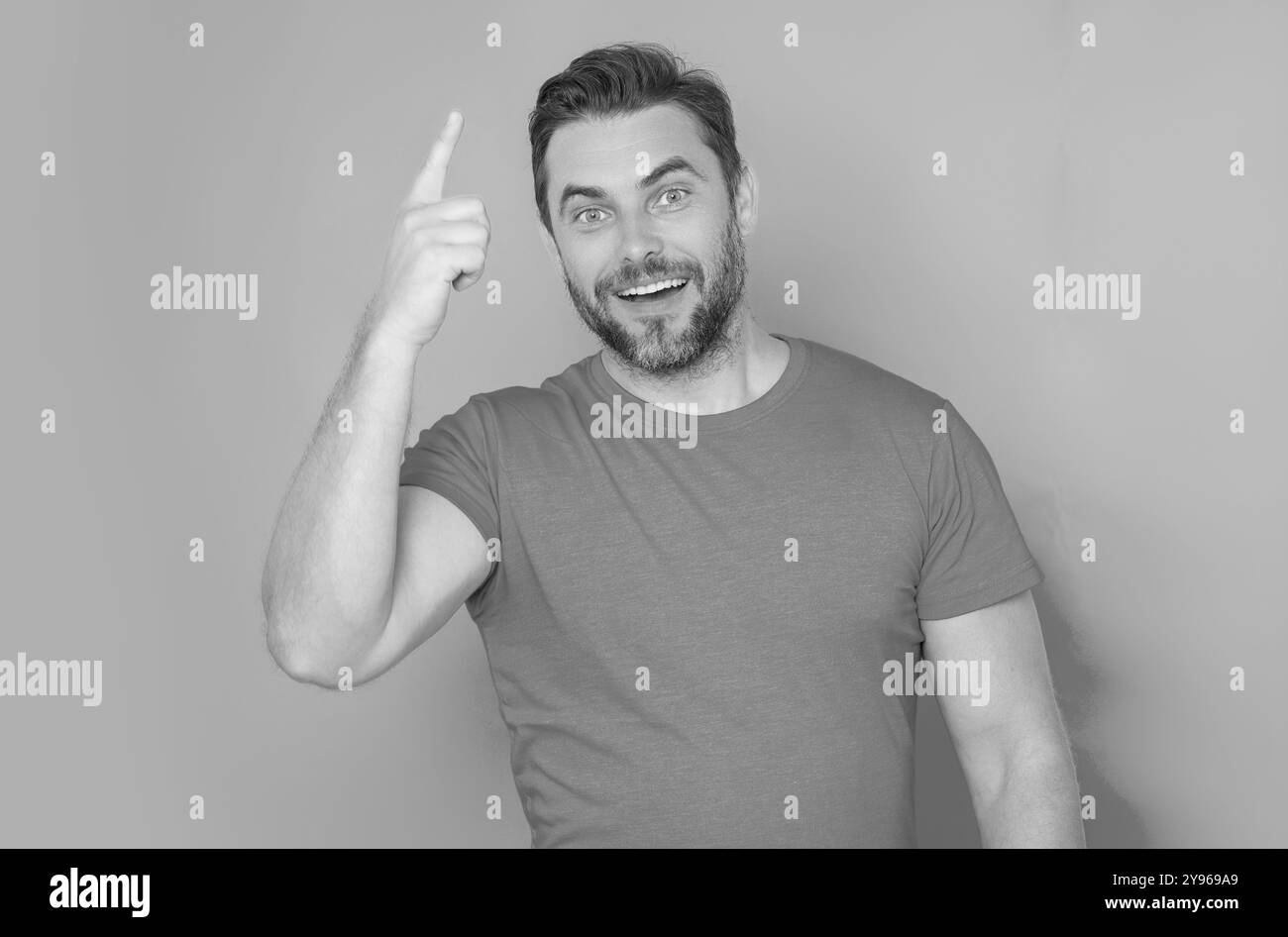 Smiling man thinking of idea on studio background. Portrait of man has ...