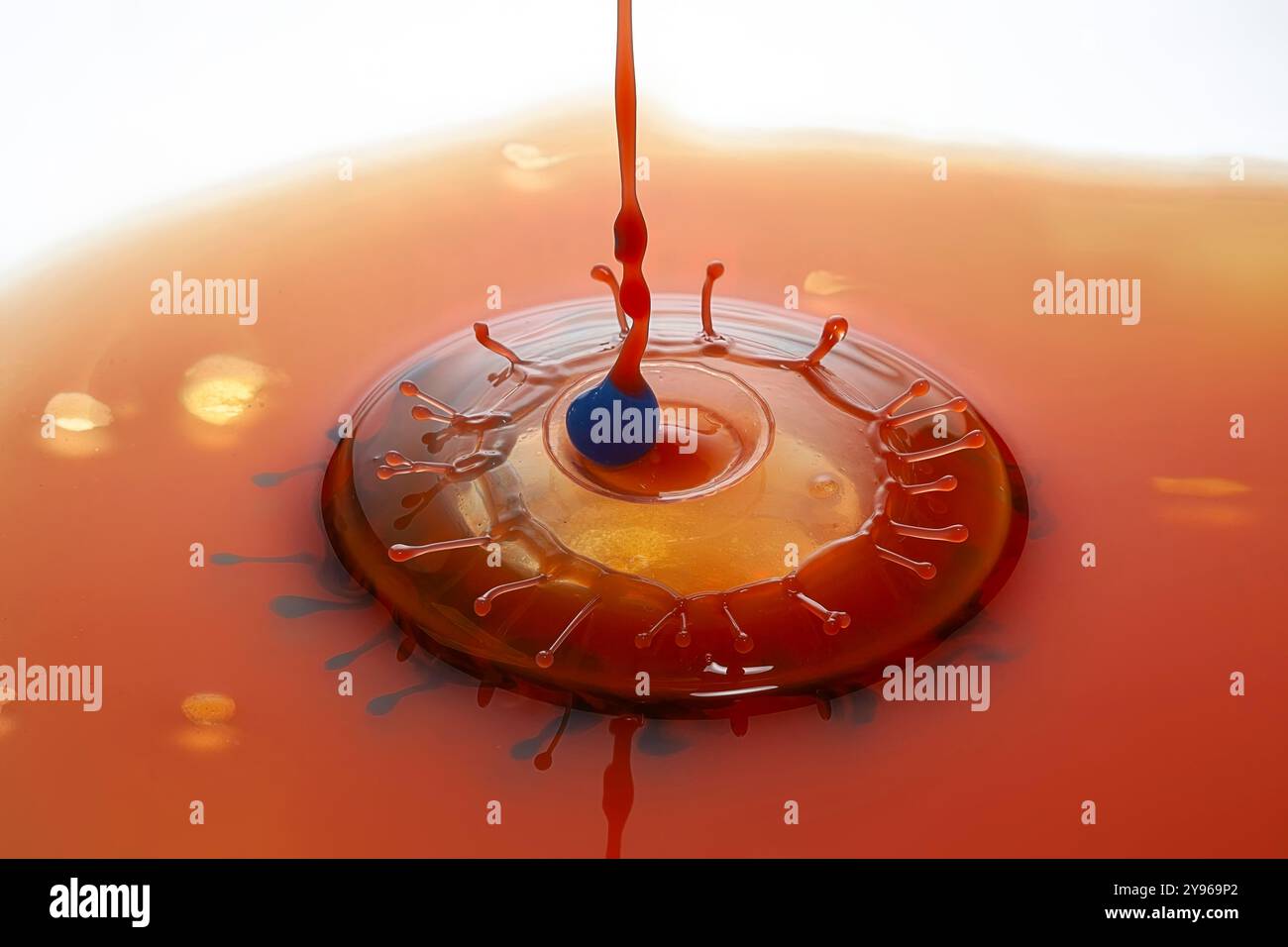 Water drop impact. High-speed photograph of secondary drop formation ...