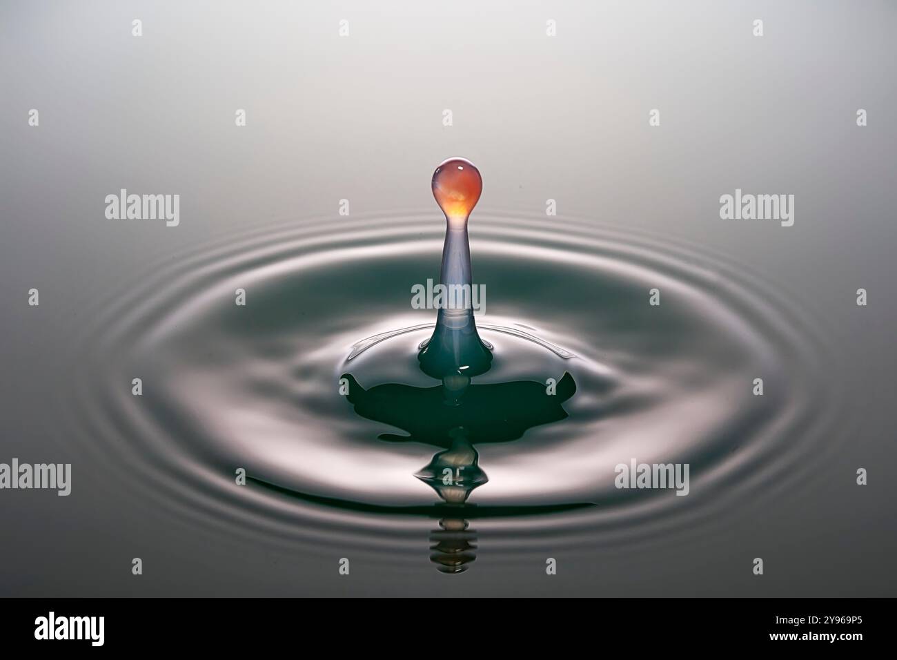 Water drop impact. High-speed photograph of secondary drop formation ...
