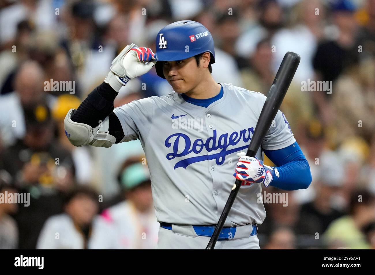 Los Angeles Dodgers' Shohei Ohtani tips his helmet before his first at-bat during the first ...