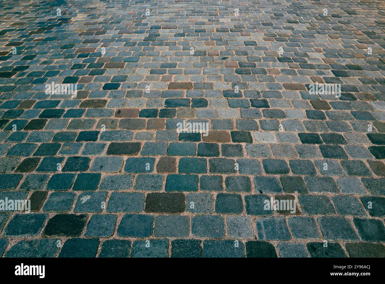 Pavement road. Background of bricks road. Stone cladding pavement ...