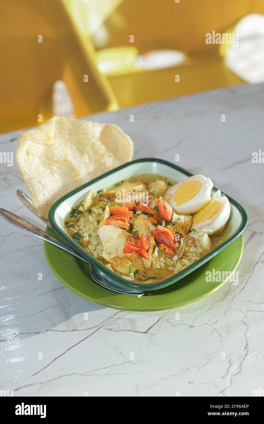 "Traditional Indonesian Soto Dish with Boiled Egg and Crispy Crackers ...