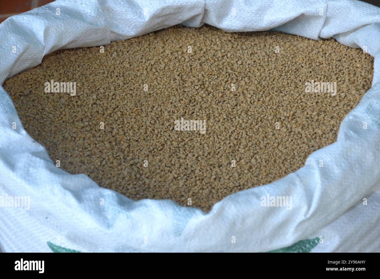 chicken feed cattle on the white sack Stock Photo - Alamy