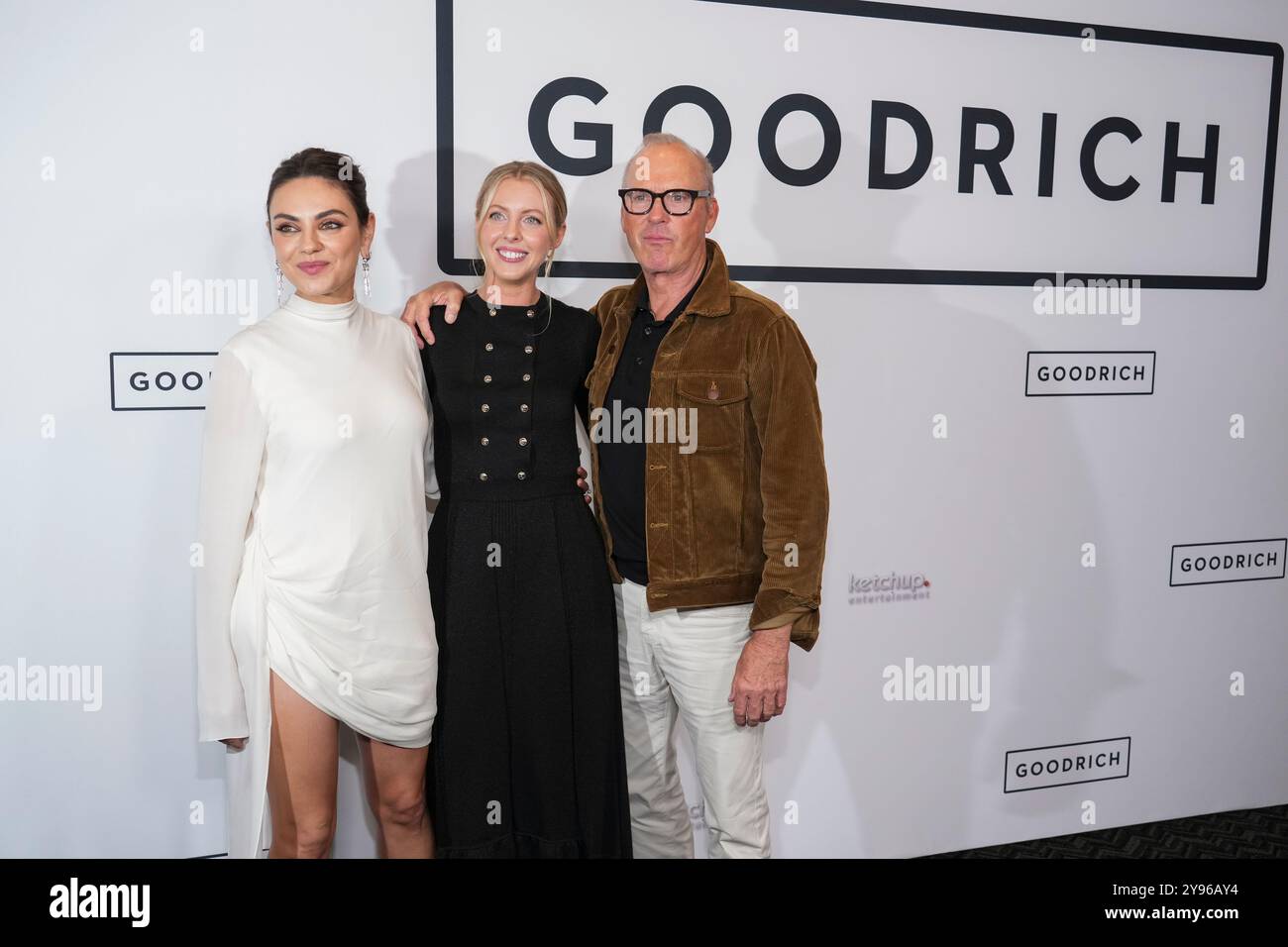 Mila Kunis, from left, Hallie Meyers-Shyer, and Michael Keaton arrive ...