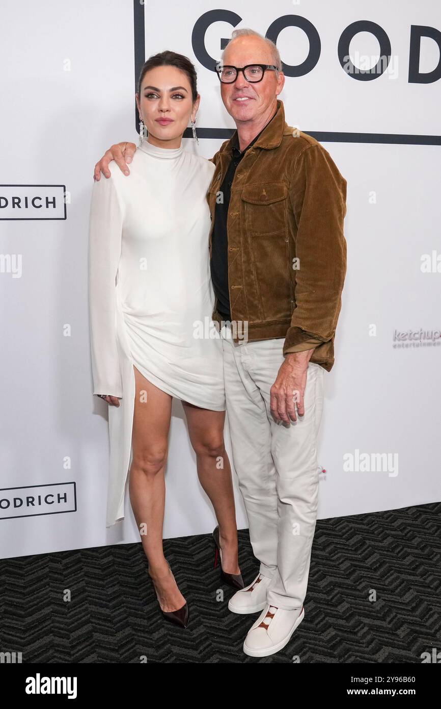 Mila Kunis, left, and Michael Keaton arrive at the premiere of ...