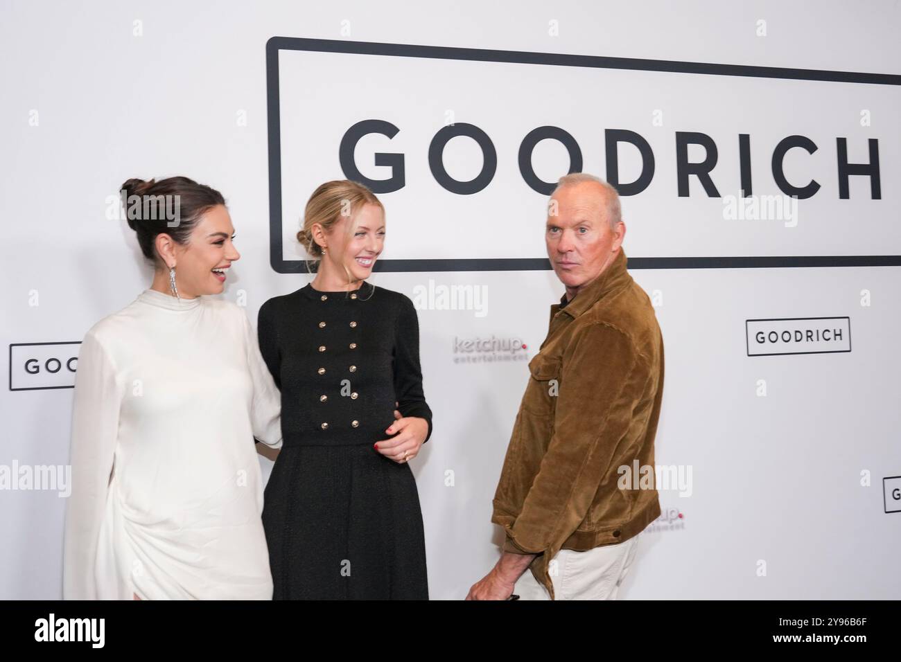 Mila Kunis, from left, Hallie Meyers-Shyer, and Michael Keaton arrive ...