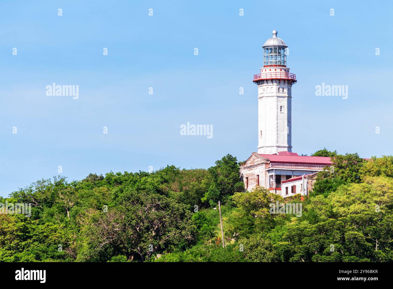 Cape Bojeador Lighthouse stands atop a hill in Ilocos, Philippines ...