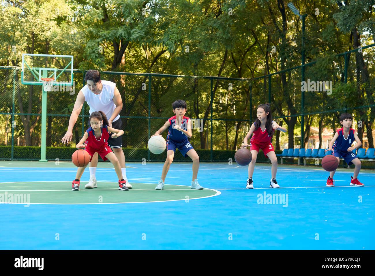 Kids Warming Up During Basketball Training Class Stock Photo - Alamy