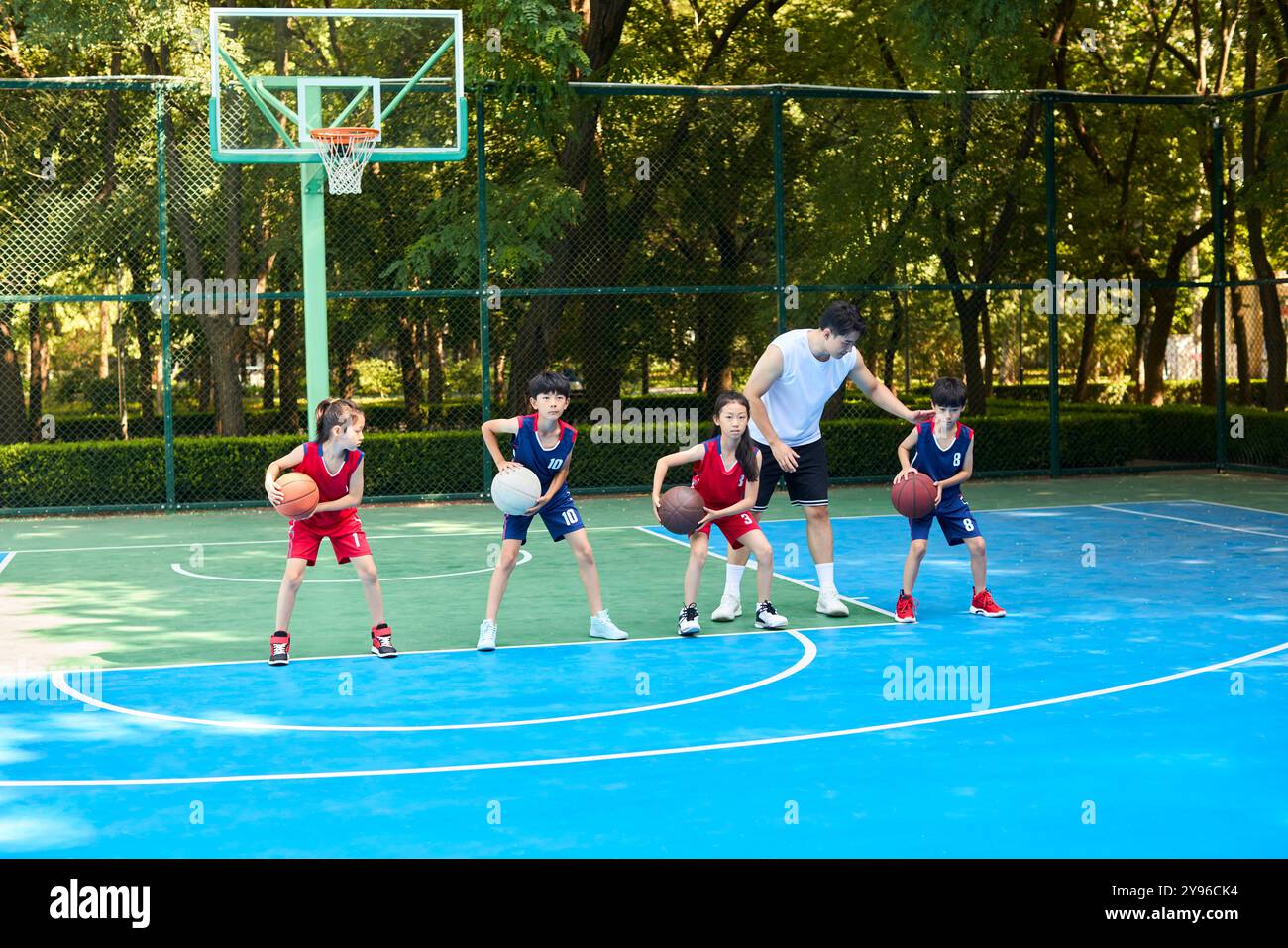 Kids Warming Up During Basketball Training Class Stock Photo - Alamy