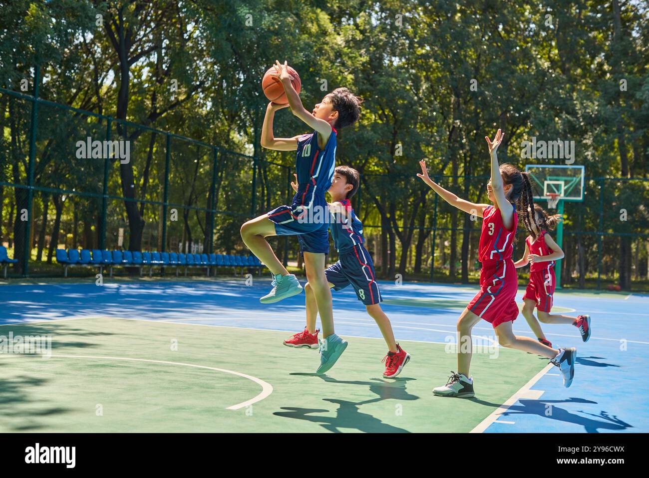 Kids Playing Basketball on Basketball Court Stock Photo - Alamy