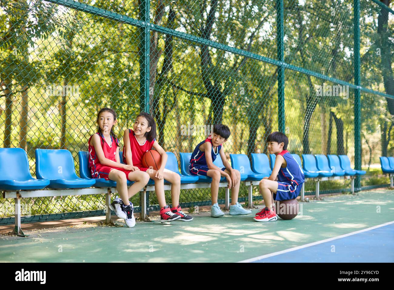 Kid Basketball Players Taking a Break Stock Photo - Alamy