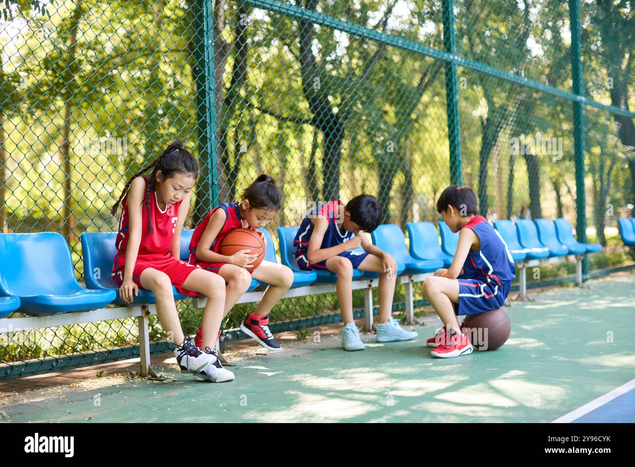 Kid Basketball Players Taking a Break Stock Photo - Alamy
