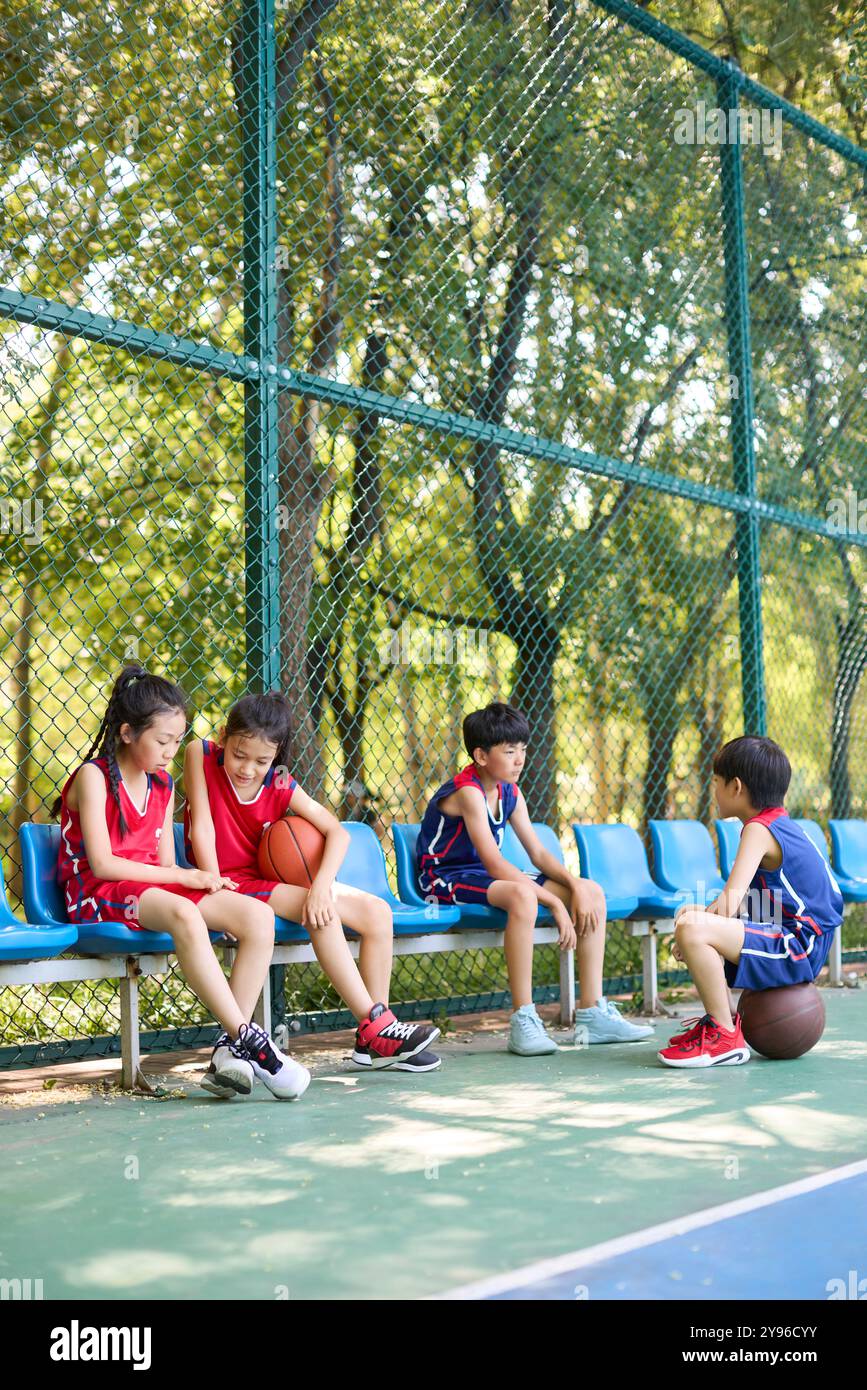 Kid Basketball Players Taking a Break Stock Photo - Alamy