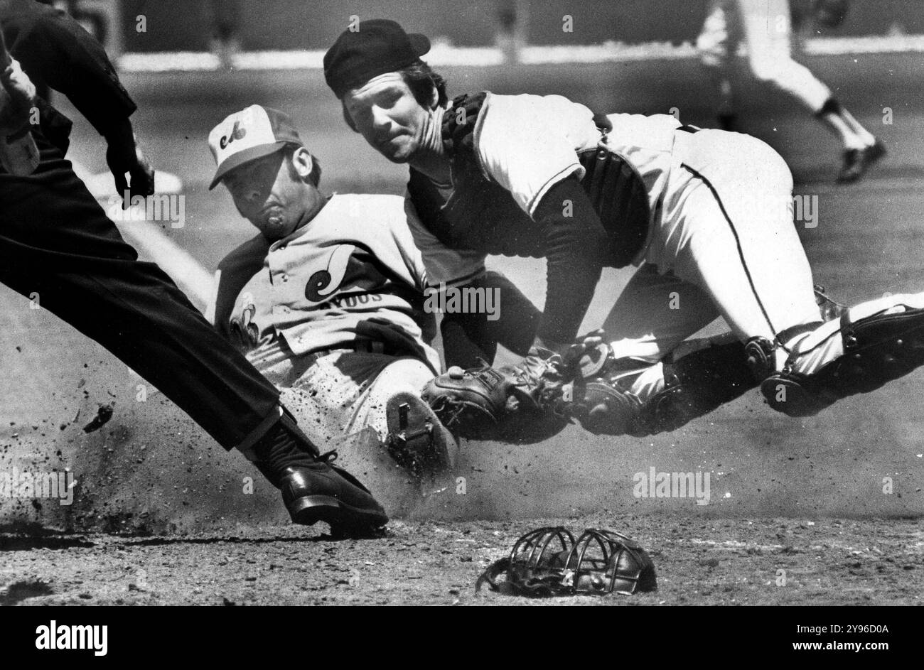 Giants catcher Dave Rader is hit with a hard slide from Montreal Expo ...