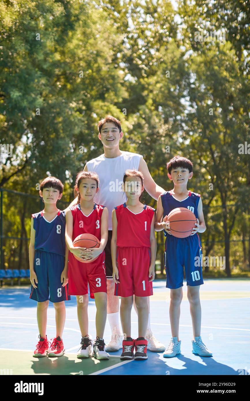 Coach and Kids in Basketball Training Class Stock Photo - Alamy