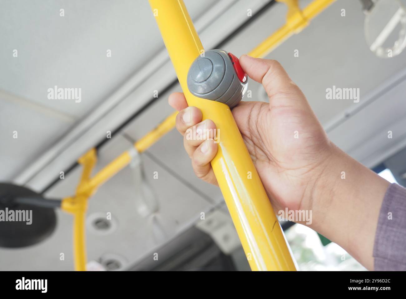 hand pressing Bus bell switch for stop inside the public bus Stock ...