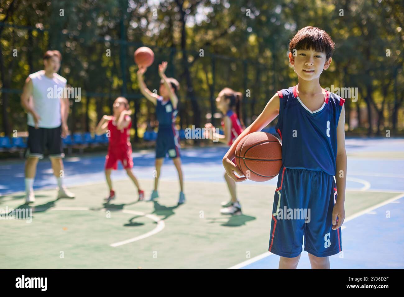 Coach and Kids in Basketball Training Class Stock Photo - Alamy