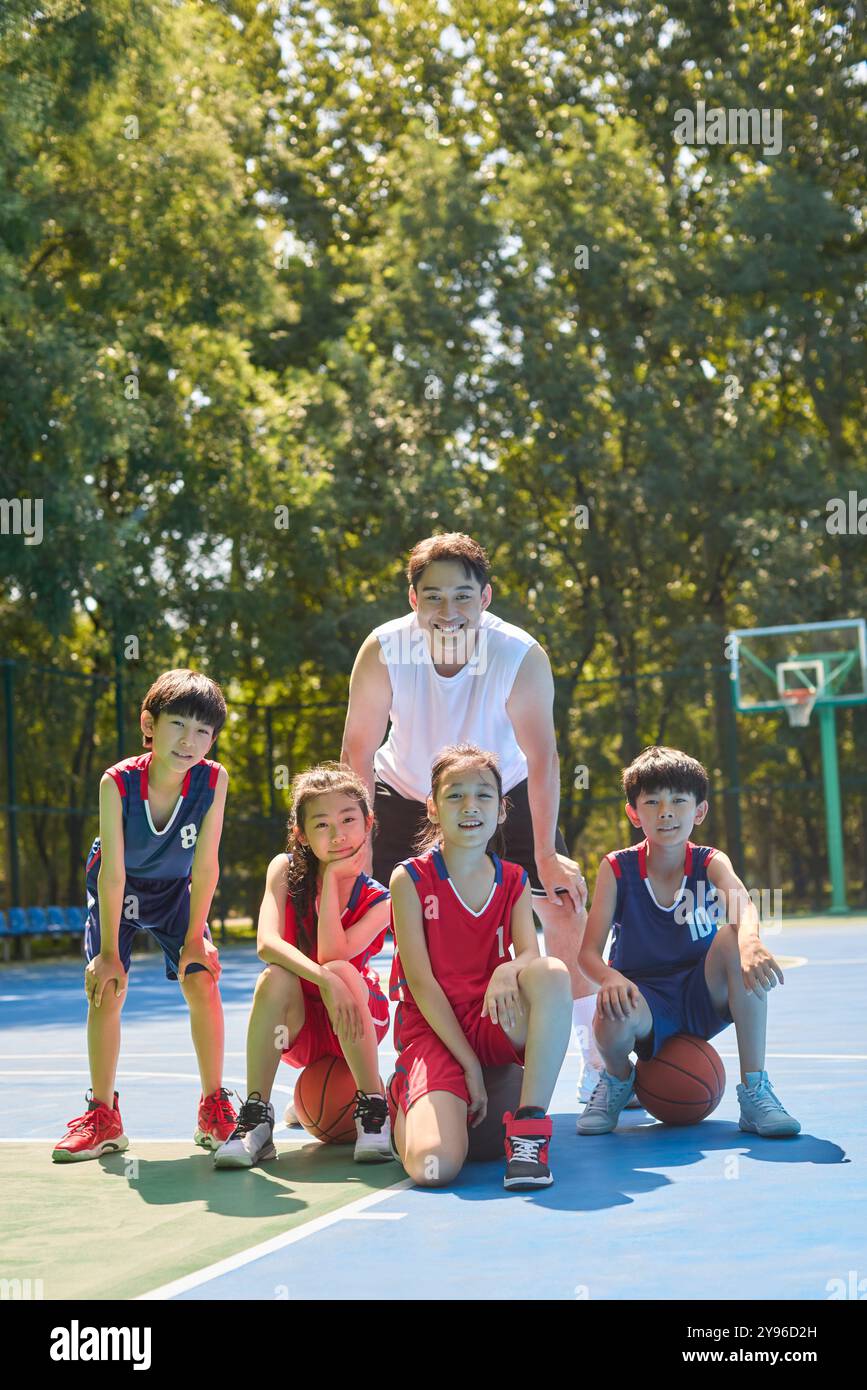 Coach and Kids in Basketball Training Class Stock Photo - Alamy