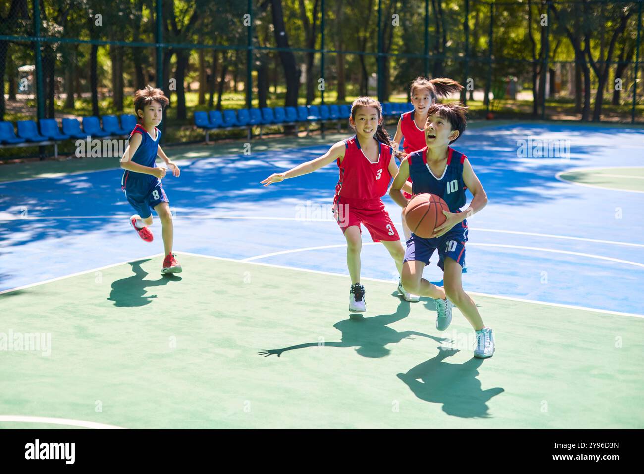 Kids Playing Basketball on Basketball Court Stock Photo - Alamy