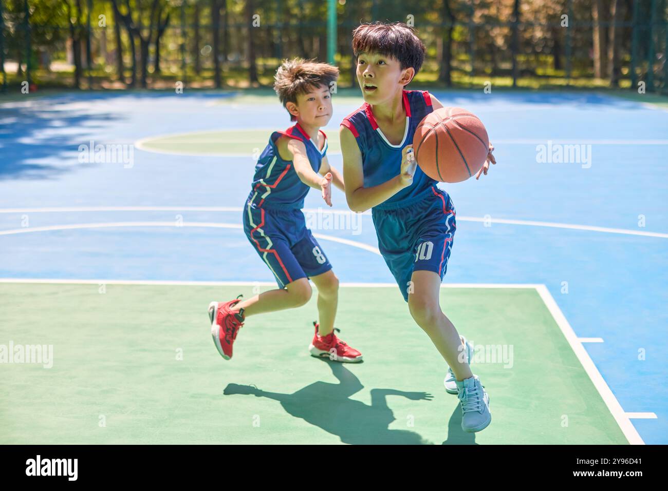 Kids Playing Basketball on Basketball Court Stock Photo - Alamy