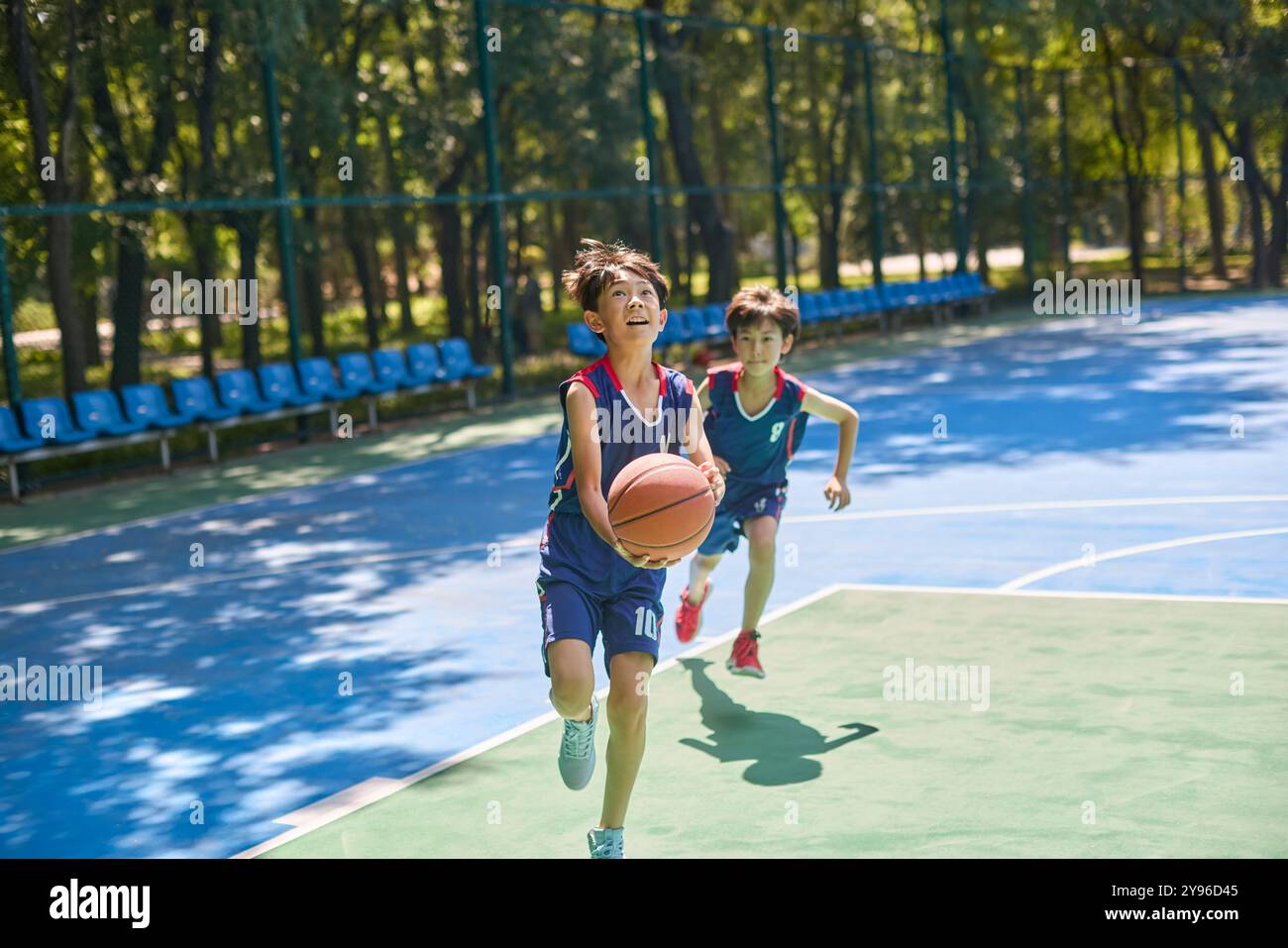 Kids Playing Basketball on Basketball Court Stock Photo - Alamy