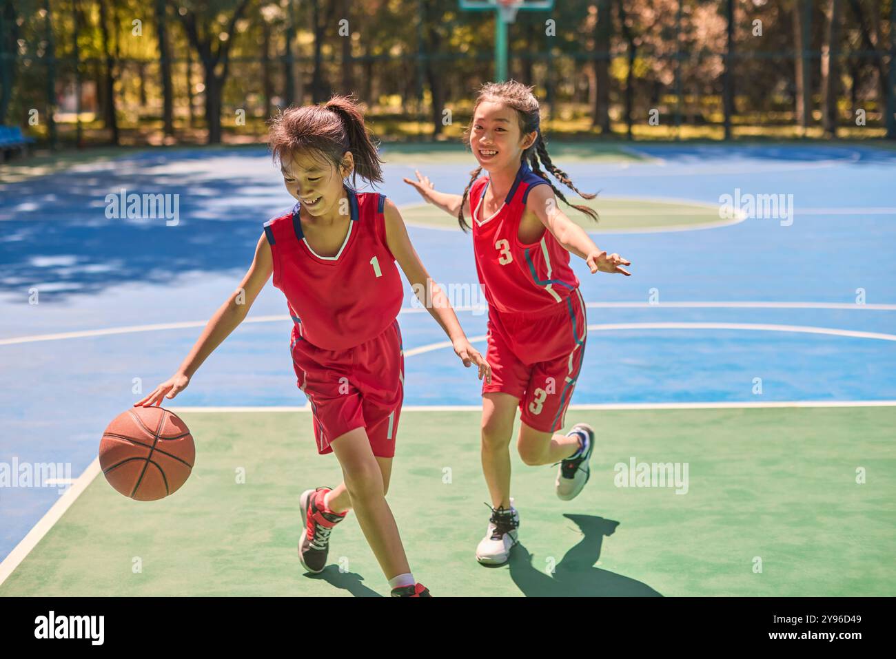 Kids Playing Basketball on Basketball Court Stock Photo - Alamy