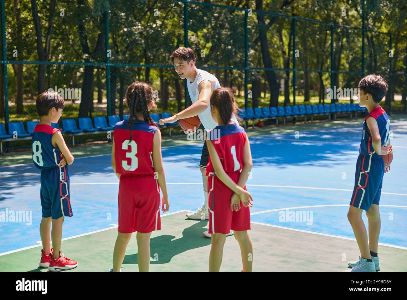 Coach and Kids in Basketball Training Class Stock Photo - Alamy