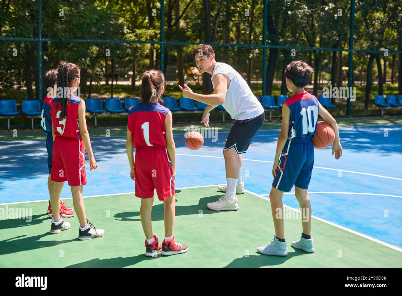 Coach and Kids in Basketball Training Class Stock Photo - Alamy