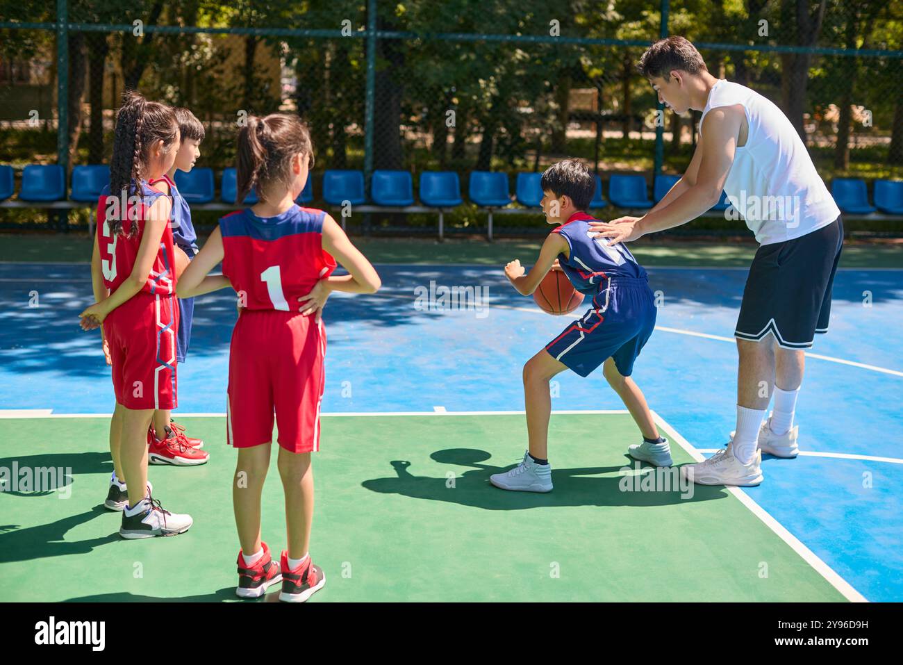 Coach and Kids in Basketball Training Class Stock Photo - Alamy