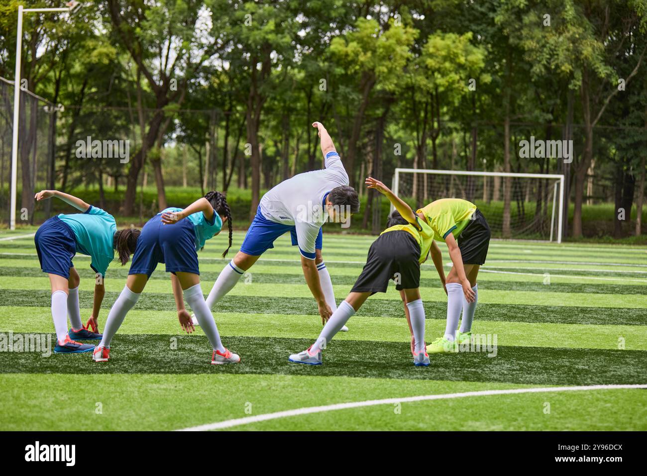 Coach and Kids in Football Training Class Stock Photo - Alamy