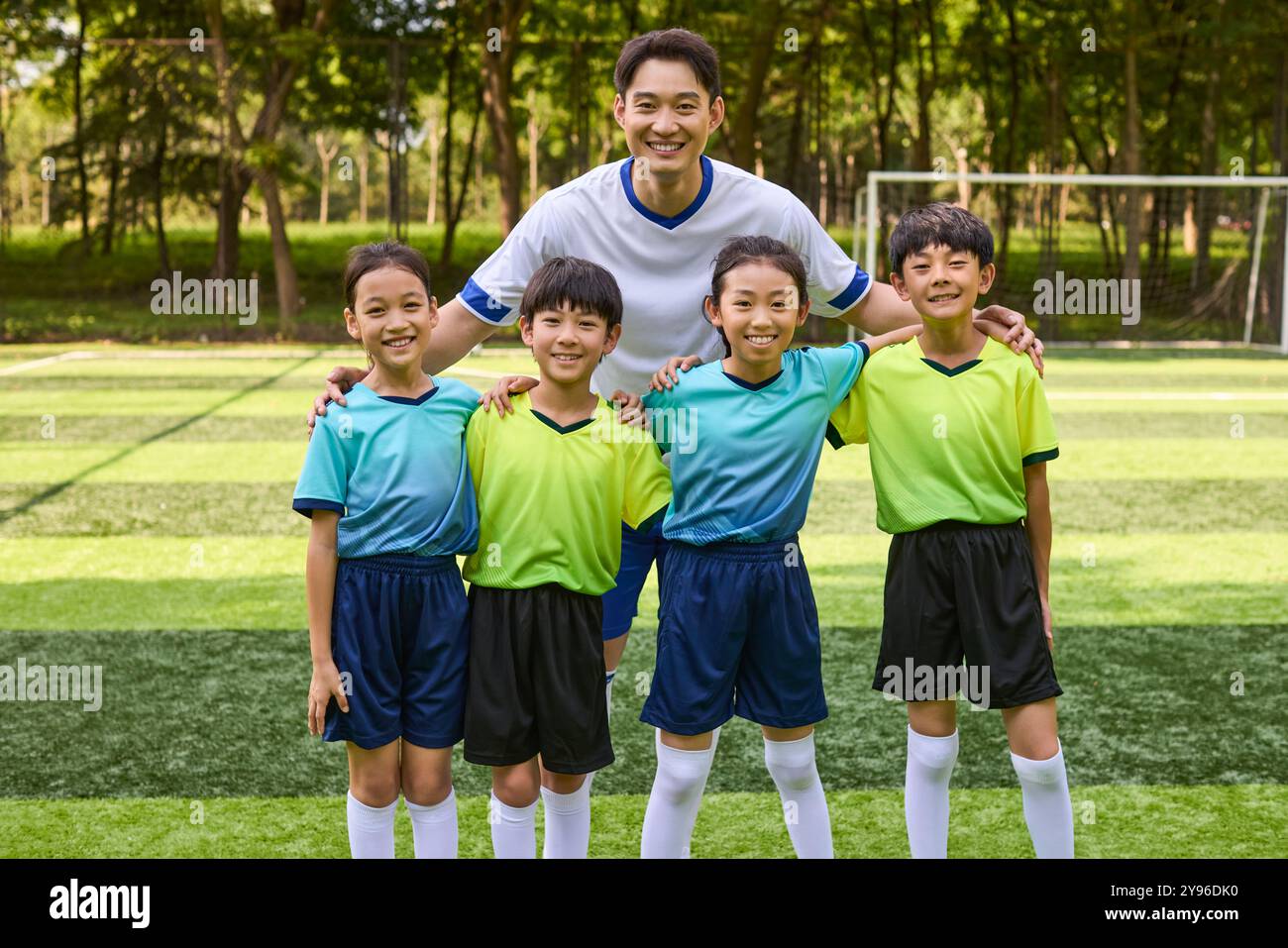 Coach and Kids in Football Training Class Stock Photo - Alamy