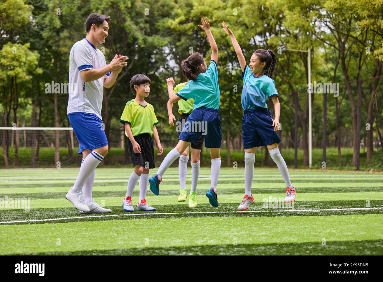 Coach and Kids in Football Training Class Stock Photo - Alamy