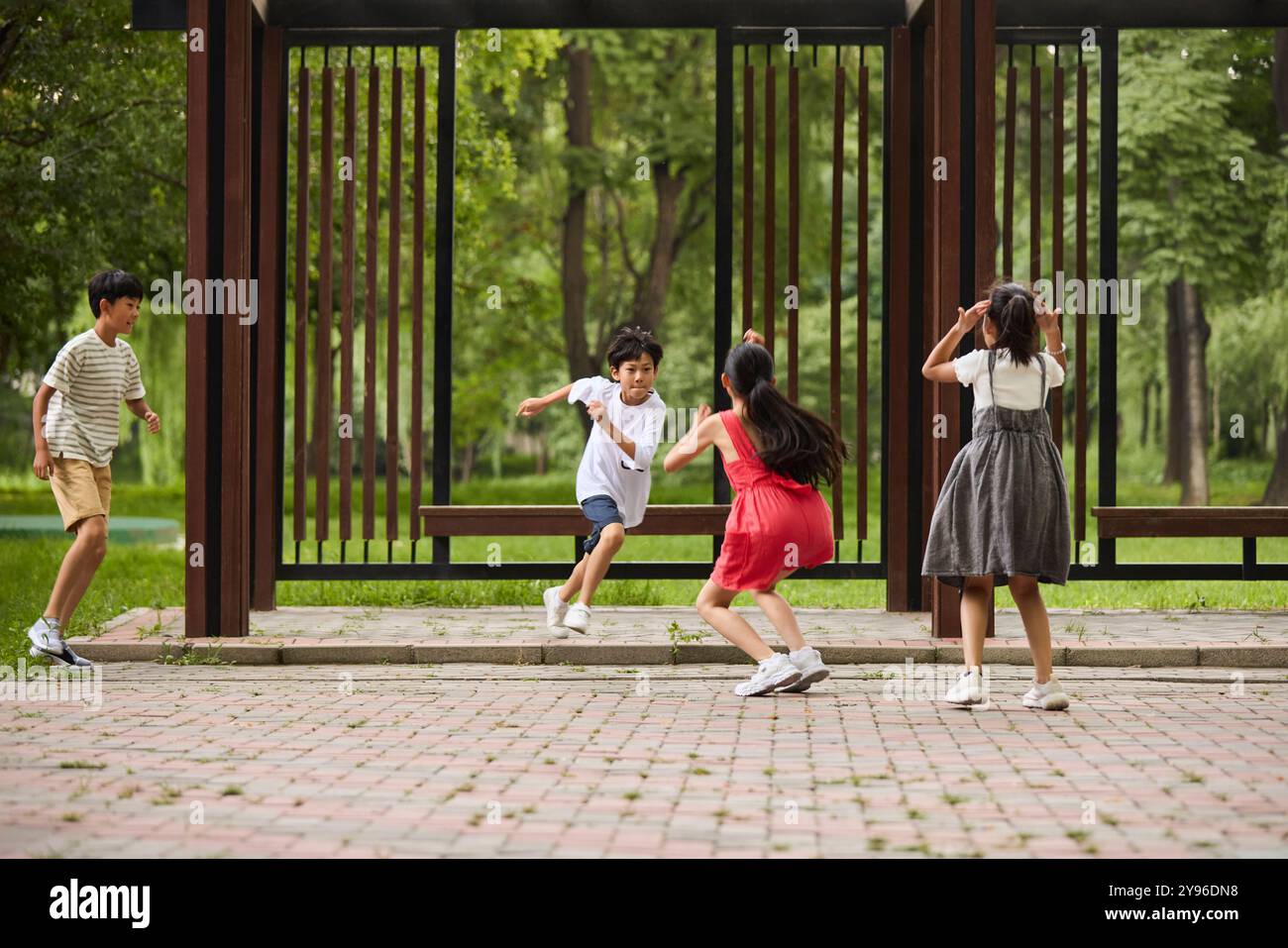 Kids Running and Chasing in Park Stock Photo - Alamy