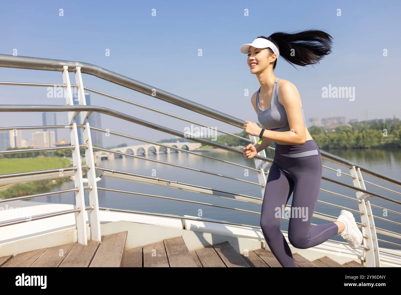 Outdoorsy young woman jogging in a park Stock Photo - Alamy