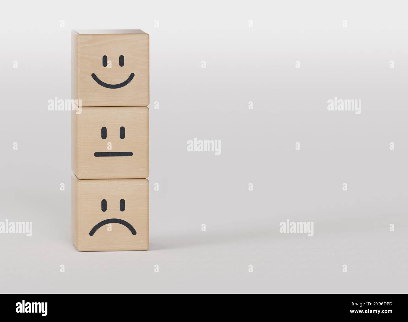 Happy, sad and neutral emotion faces on stacking wooden cubes ...